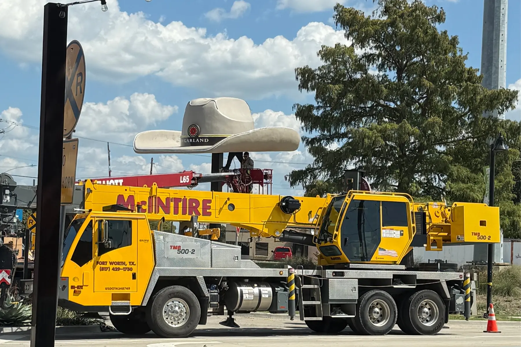 Big-ass cowboy hat being installed in Garland - D Magazine